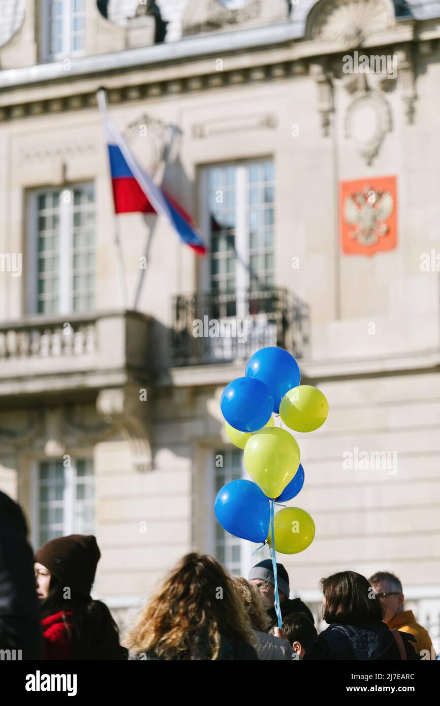 Strasbourg, France - Mar 6, 2022: Rear view of woman holding yellow ...