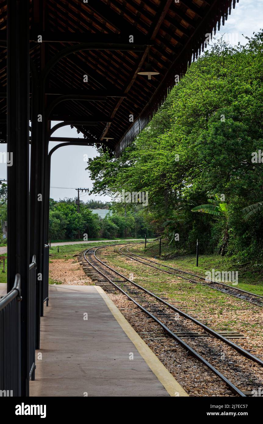 The empty colonial Tiradentes train station platform with train tracks ...