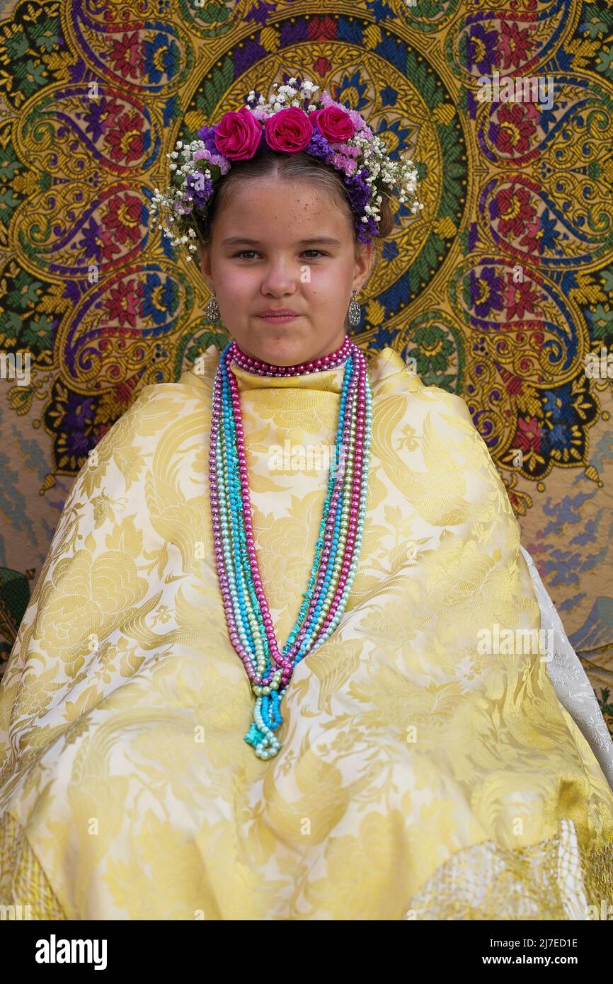 Madrid, Spain - 08 May 2022, A girl, La Maya, sits on an altar during ...