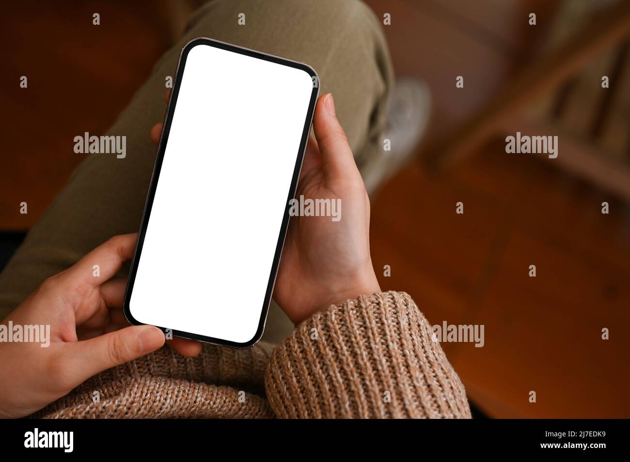 Top view, A mockup screen of a modern cellphone touchscreen in a women ...