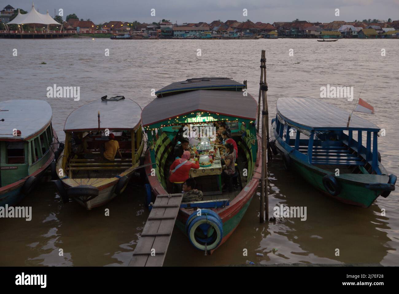 Boats functioned as floating restaurants on river Musi in Palembang ...