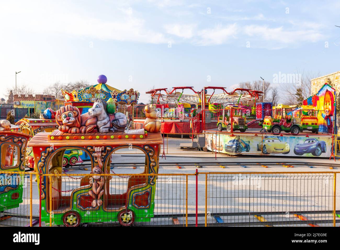 Children's rides and carousels are closed and empty. Joy and ...