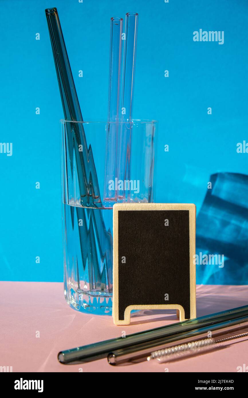 Reusable glass Straws in Glass with water on colorful background with ...