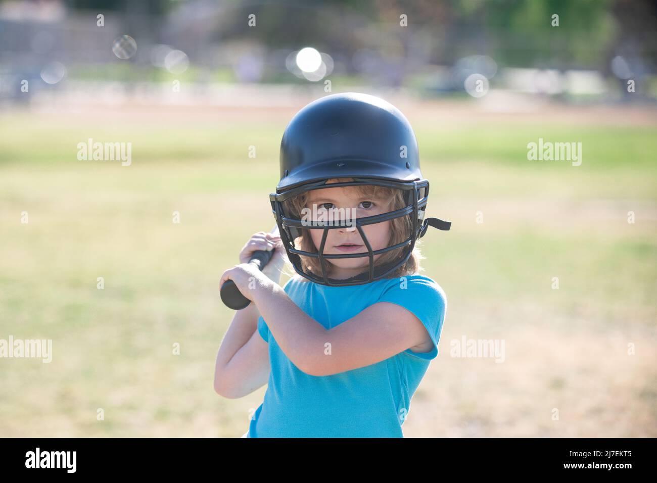 Little child baseball player focused ready to bat. Sporty kid players ...