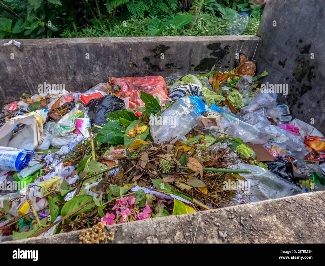 Garbage shelter on the edge of the village, mixed with natural waste ...