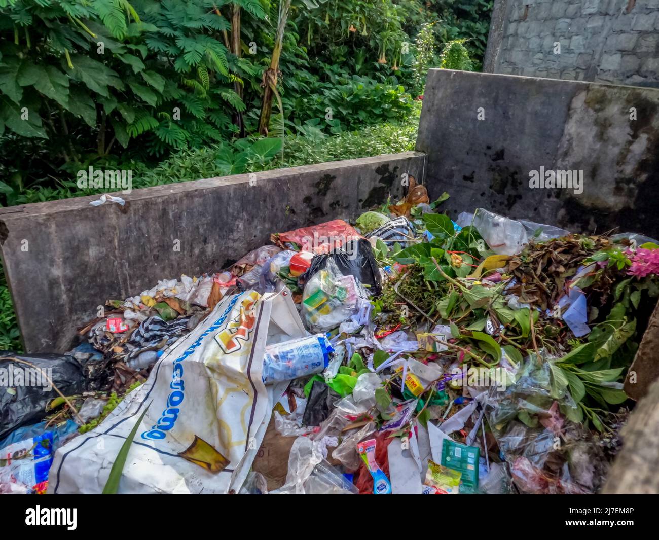Garbage shelter on the edge of the village, mixed with natural waste ...