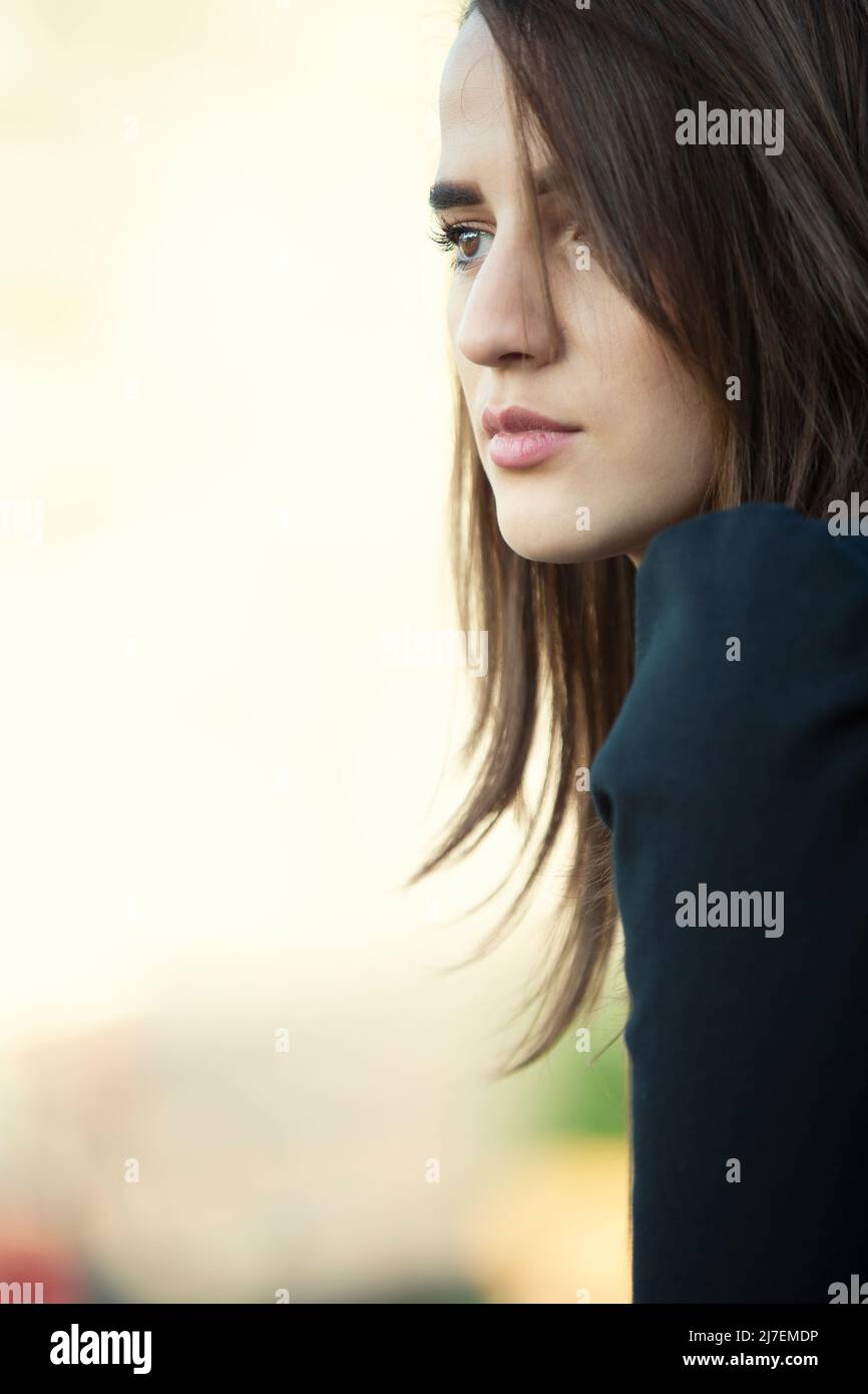 Pensive teenage girl looking away Stock Photo - Alamy