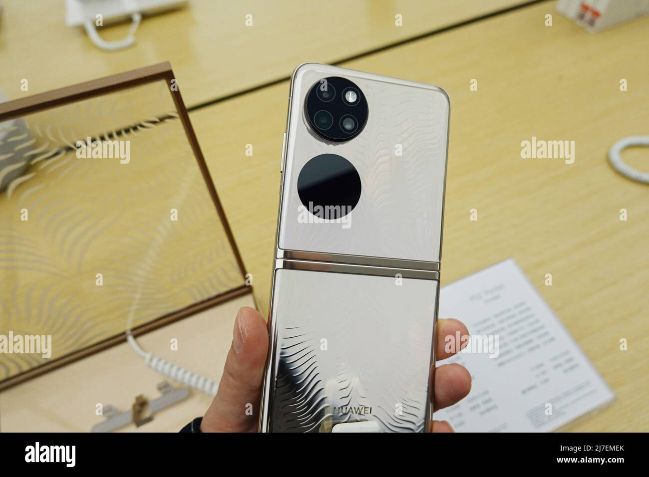A Huawei P50 Pocket 4G phone is displayed at a Huawei store in ...