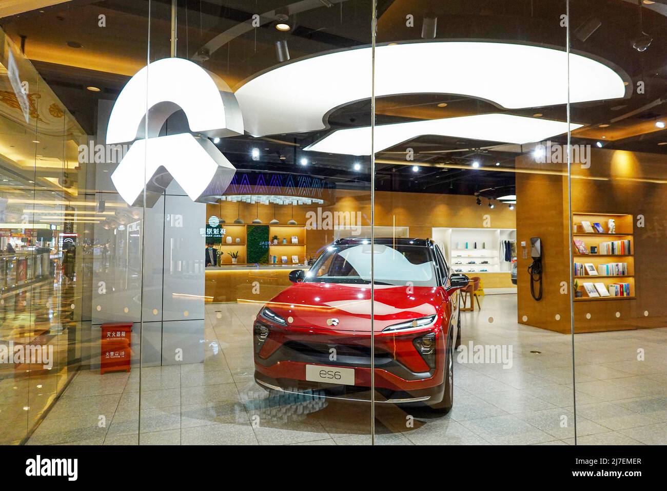 Nio cars and logos are displayed at a Nio store in Changzhou Stock ...