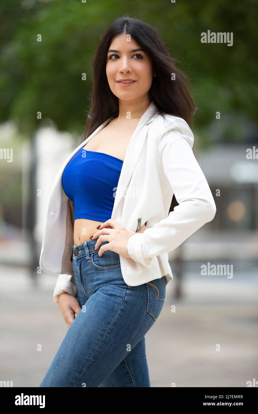Beautiful young woman wearing blazer jacket standing outdoors Stock ...