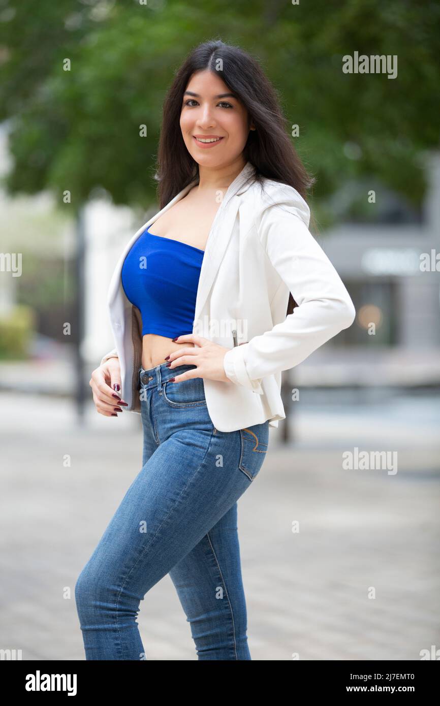 Beautiful young woman wearing blazer jacket standing outdoors Stock ...