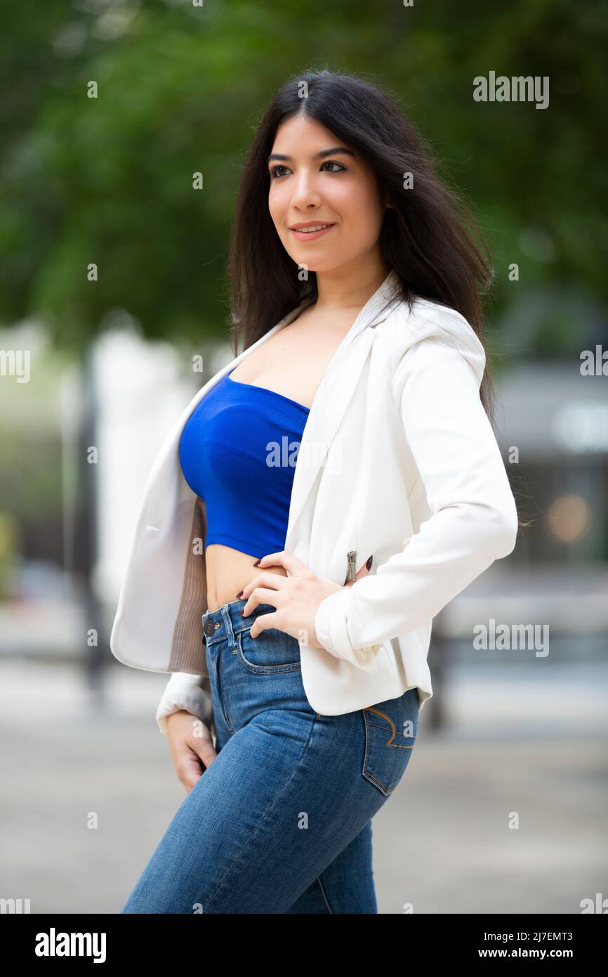 Beautiful young woman wearing blazer jacket standing outdoors Stock ...