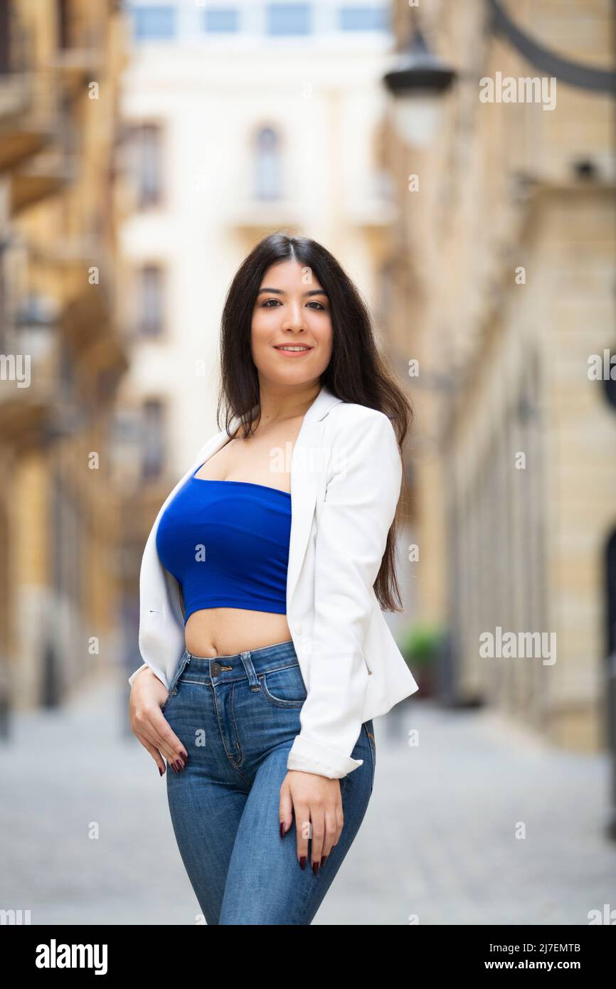 Beautiful young woman wearing blazer jacket standing outdoors Stock ...