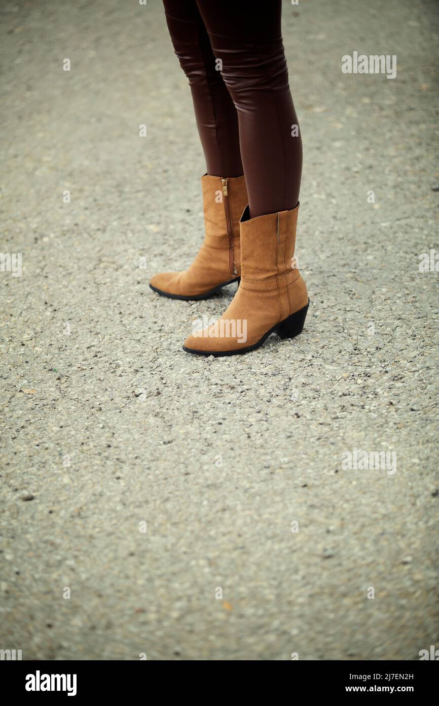 Woman wearing boots hi-res stock photography and images - Alamy