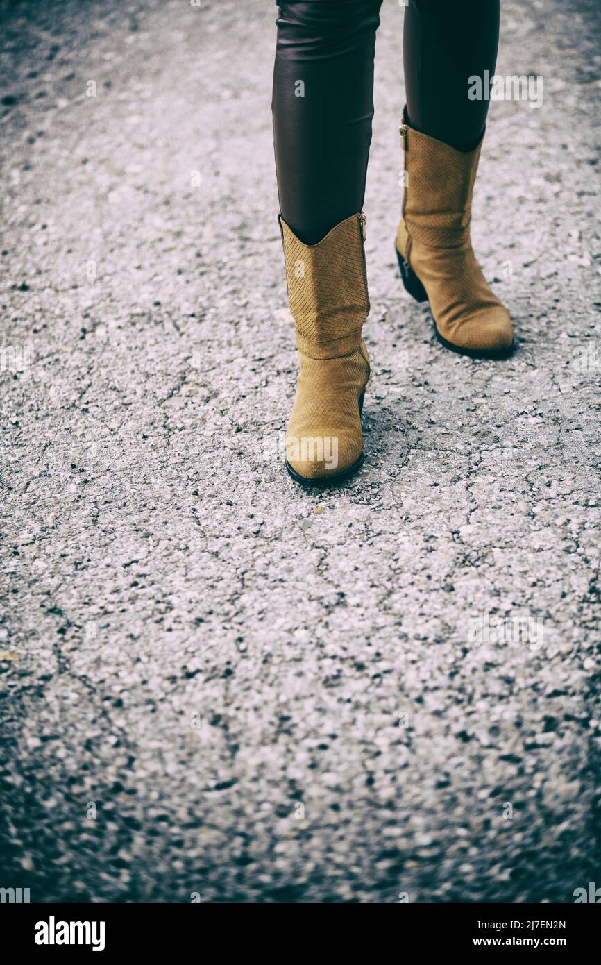 Woman wearing boots hi-res stock photography and images - Alamy