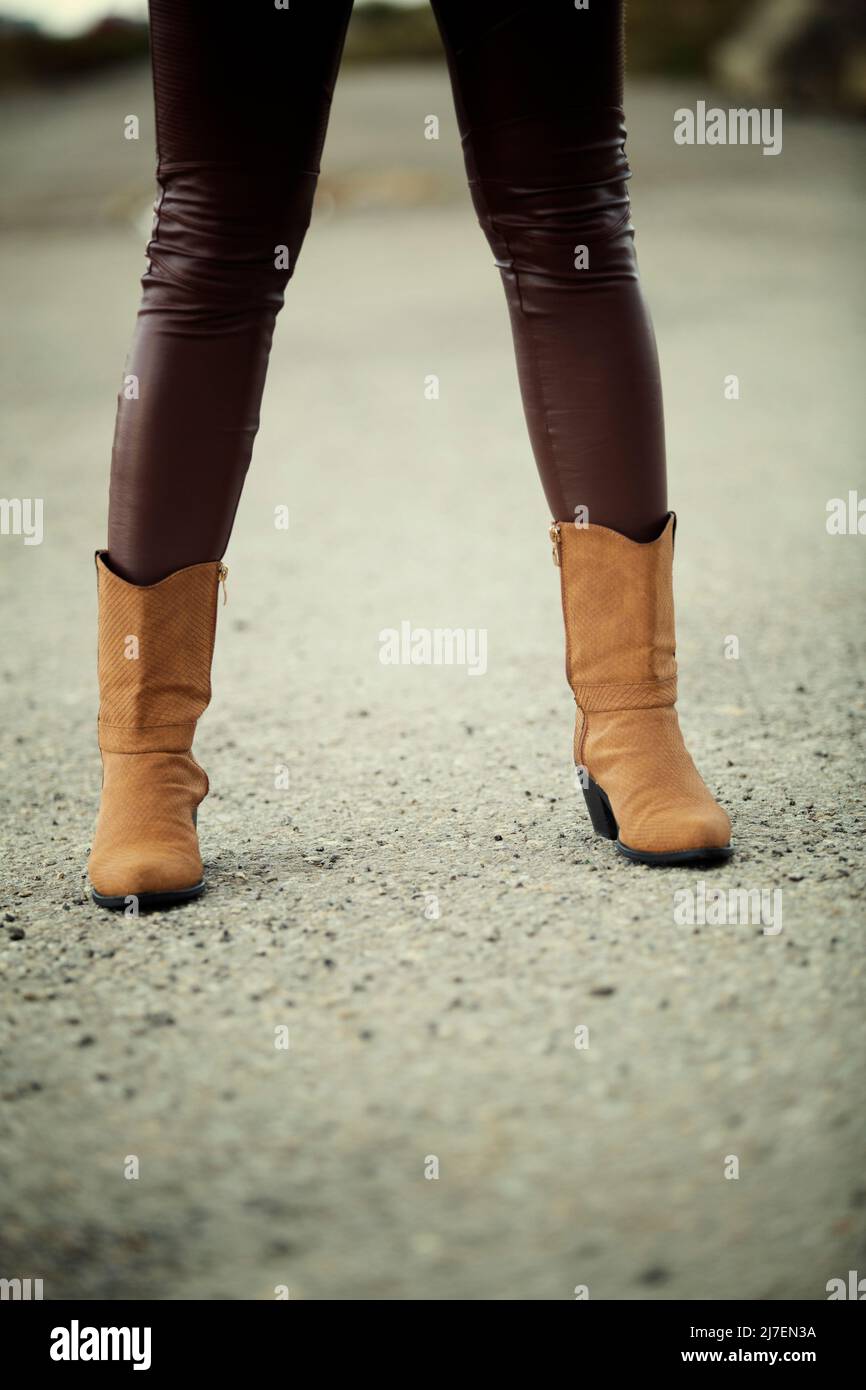 Woman wearing boots hi-res stock photography and images - Alamy
