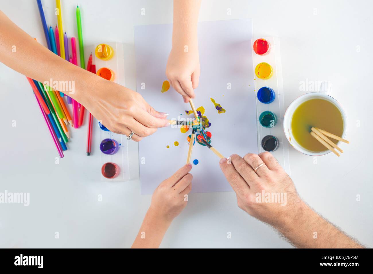 Kids drawing with crayons at a table hi-res stock photography and ...