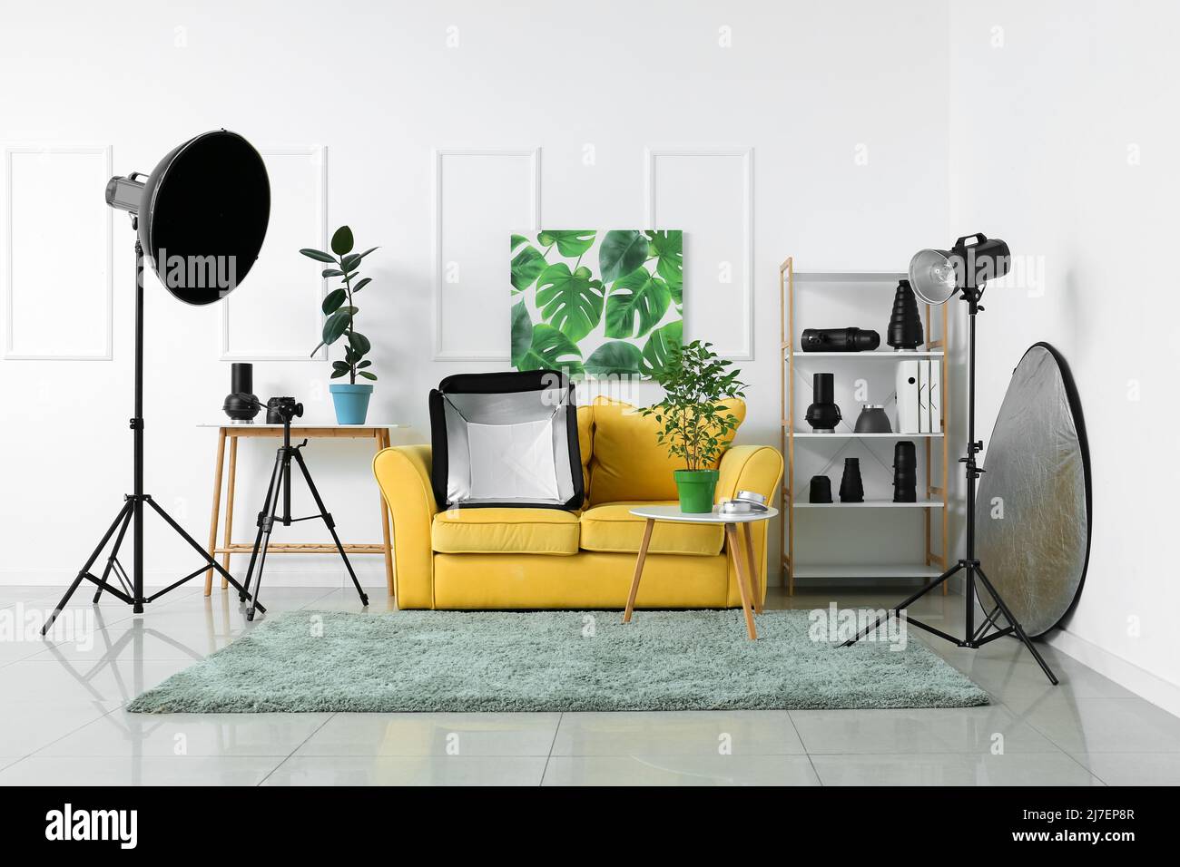 Interior of stylish photo studio with comfortable sofa and modern ...