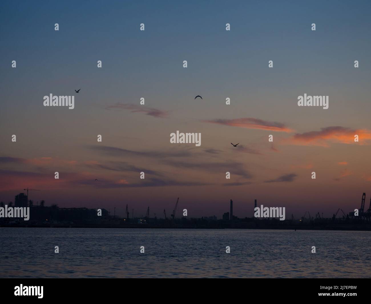 black sea port Odesa, Ukraine with a lot of cranes, cabins, boxes and ...