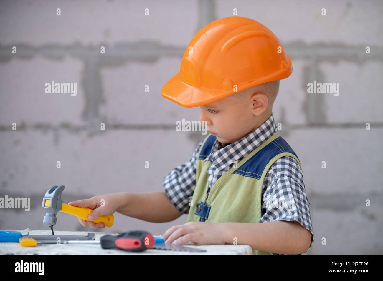 Kid worker drill hi-res stock photography and images - Alamy