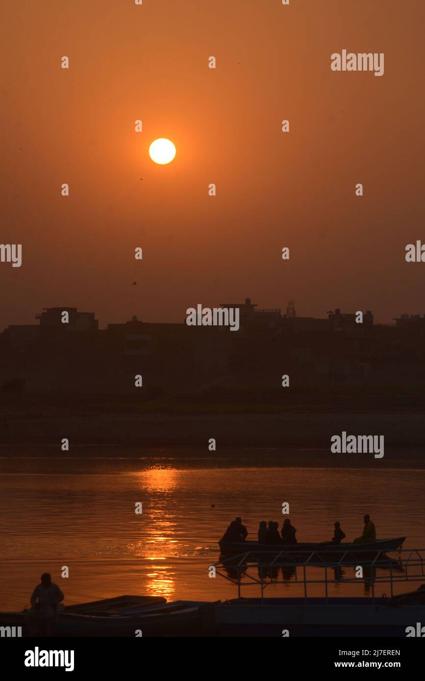 Pakistani people enjoying boating in Ravi River during sunset in Lahore. (Photo by Rana Sajid ...