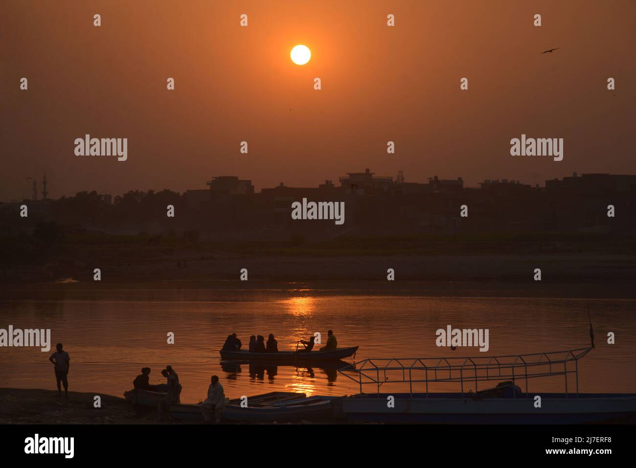 Pakistani people enjoying boating in Ravi River during sunset in Lahore ...