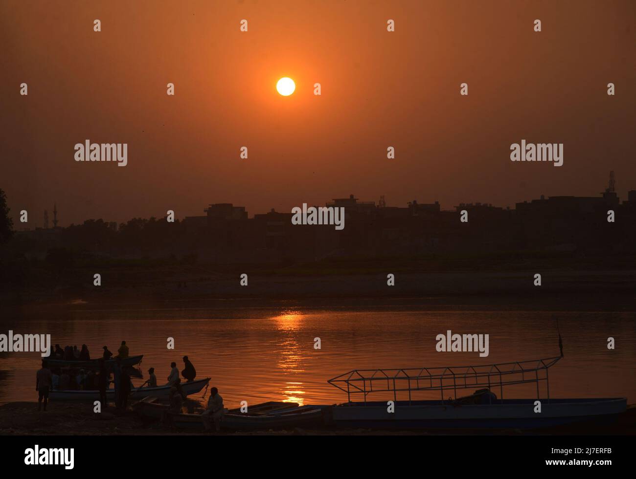 Pakistani people enjoying boating in Ravi River during sunset in Lahore ...