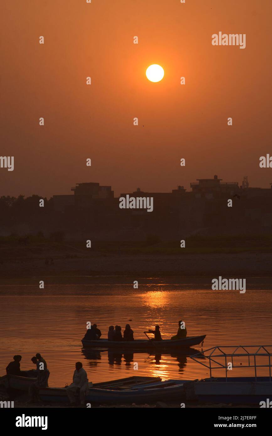 Pakistani people enjoying boating in Ravi River during sunset in Lahore ...