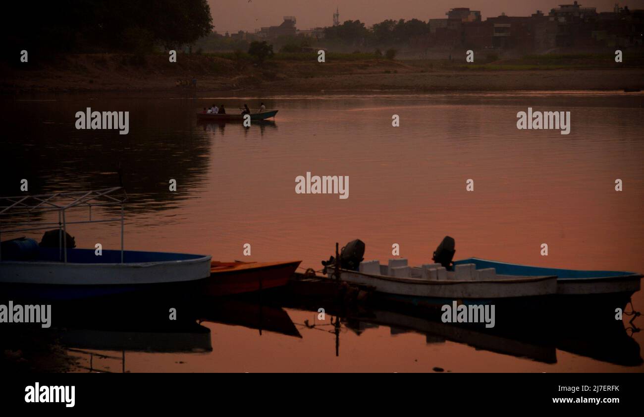 Pakistani people enjoying boating in Ravi River during sunset in Lahore ...