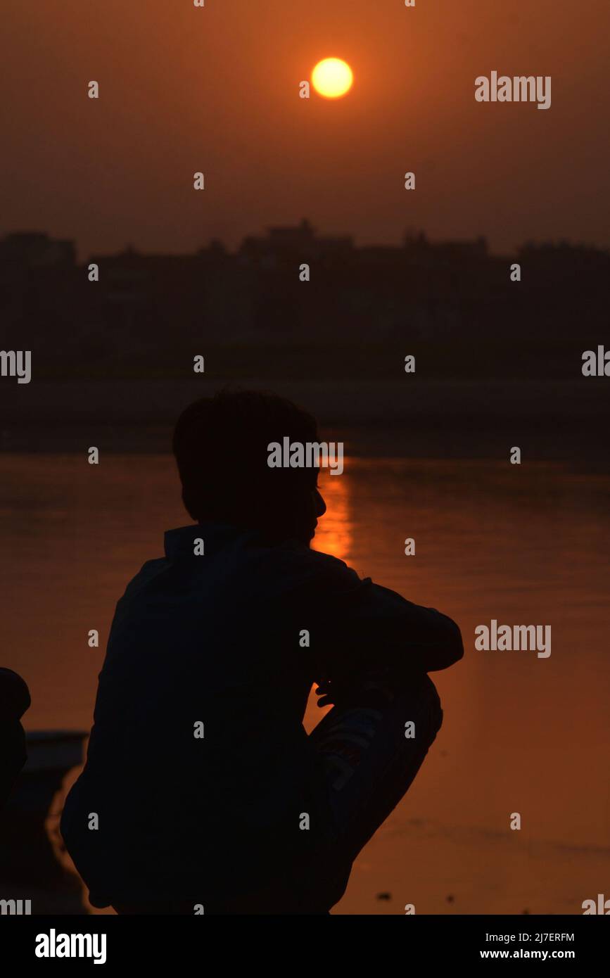 Pakistani people enjoying boating in Ravi River during sunset in Lahore. (Photo by Rana Sajid ...
