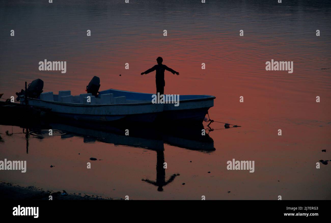 Pakistani people enjoying boating in Ravi River during sunset in Lahore ...