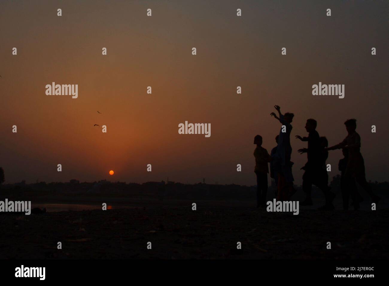 Pakistani people enjoying boating in Ravi River during sunset in Lahore ...