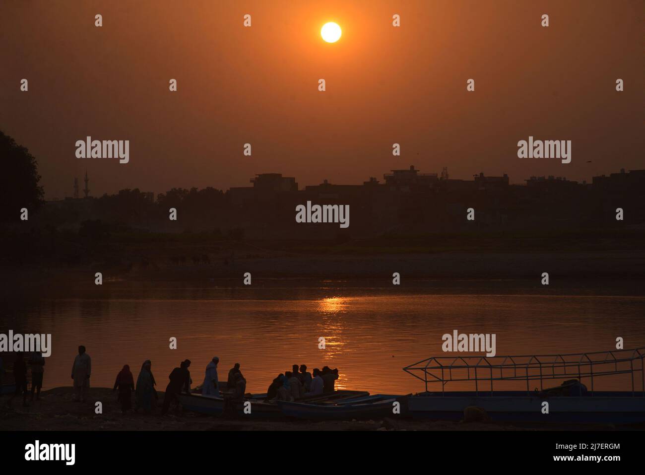 Pakistani people enjoying boating in Ravi River during sunset in Lahore ...