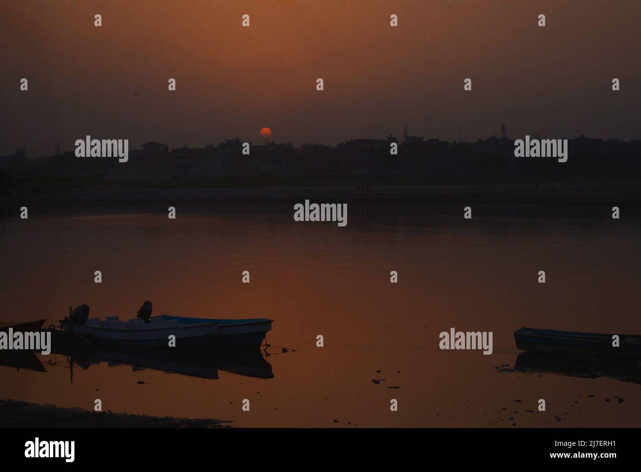Pakistani people enjoying boating in Ravi River during sunset in Lahore ...