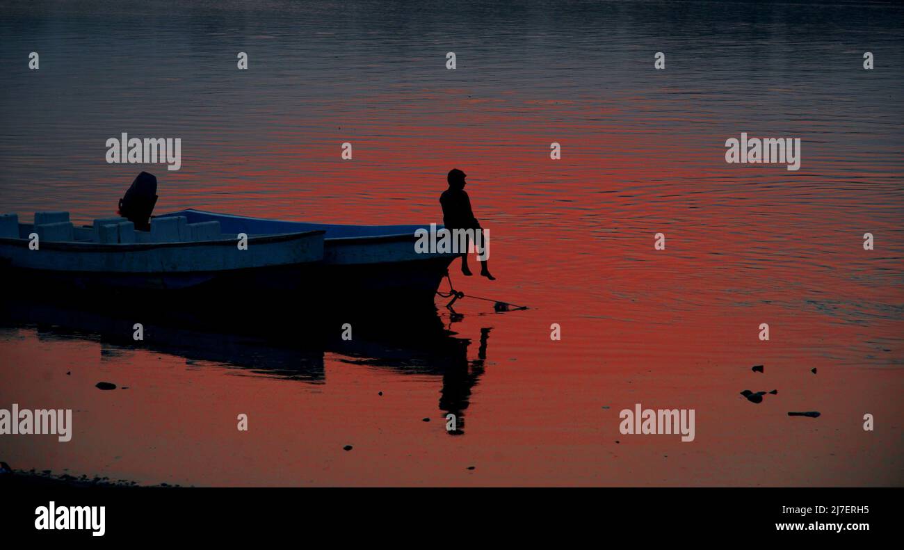 Pakistani people enjoying boating in Ravi River during sunset in Lahore ...