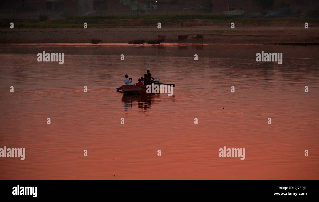 Pakistani people enjoying boating in Ravi River during sunset in Lahore ...