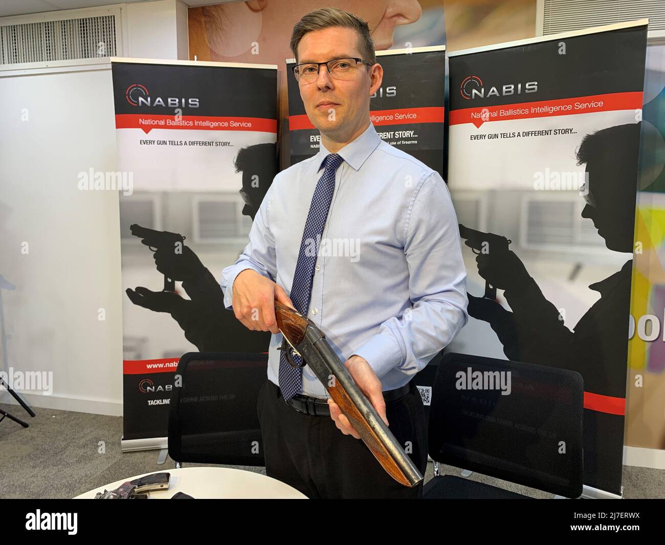 Gregg Taylor, NABIS ballistics expert holds a shotgun, from the NABIS ...