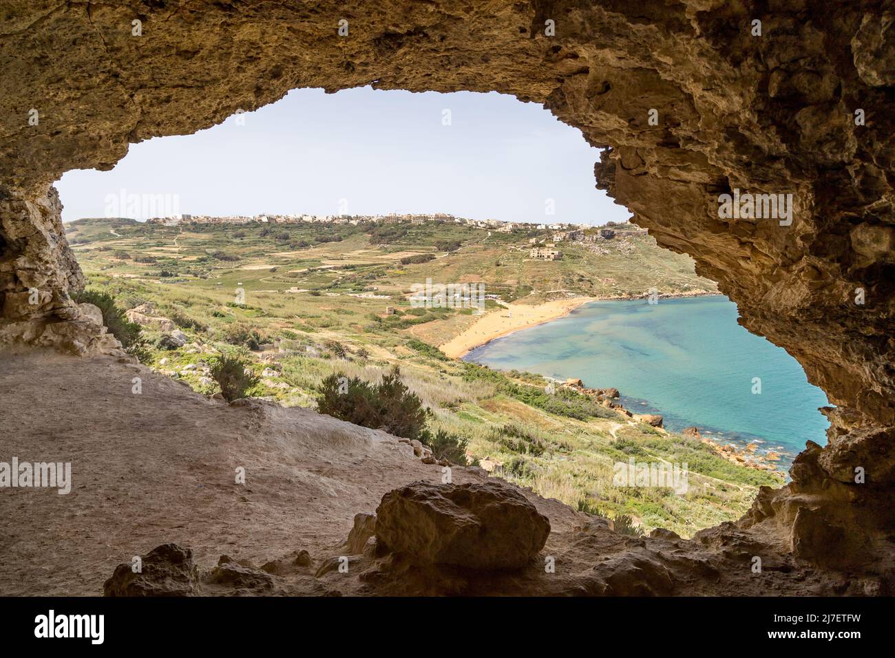 Ramla Beach seen from inside the high Tal-Mixta Cave on the island of ...