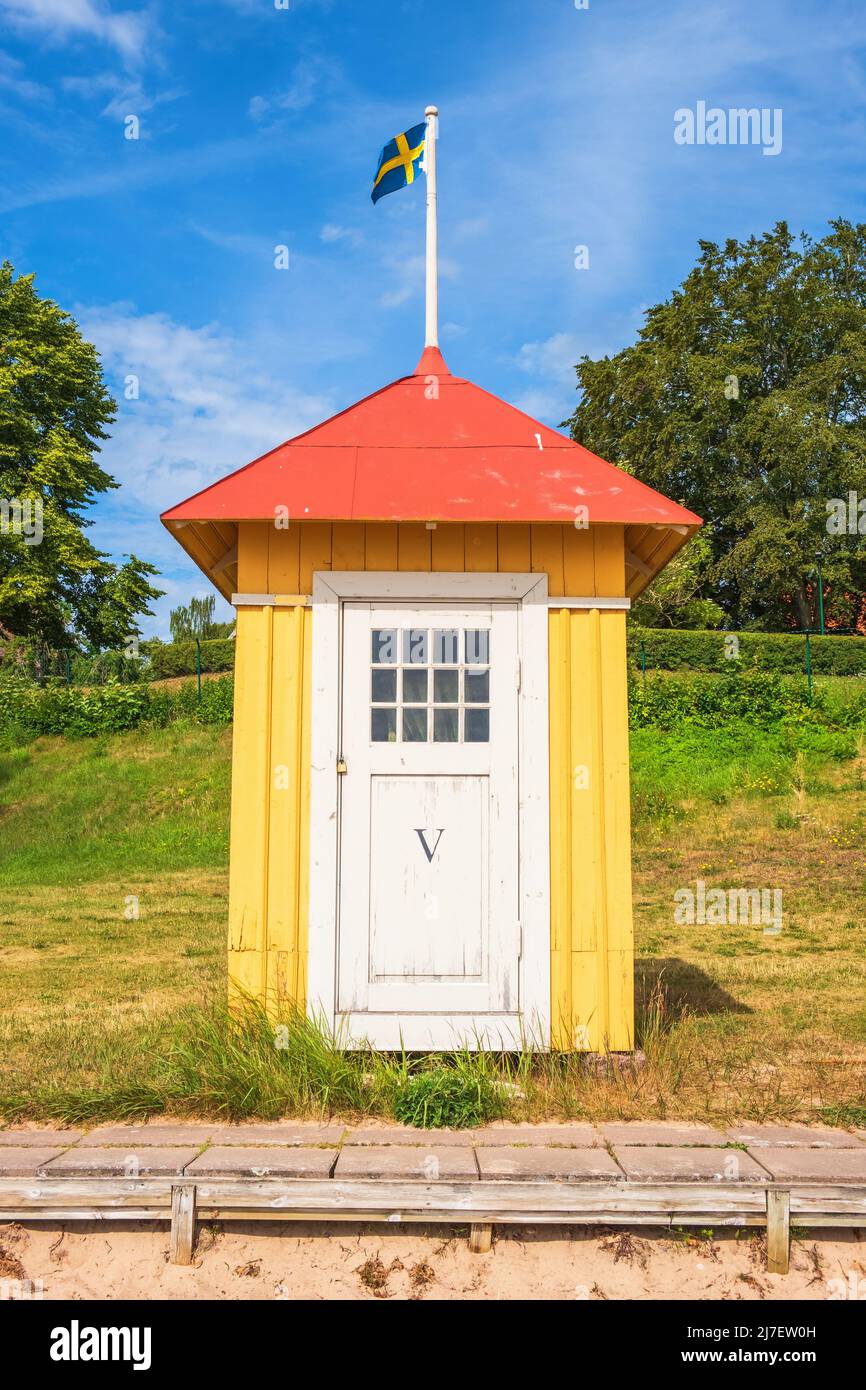Idyllic old beach hut with the swedish flag on top Stock Photo - Alamy
