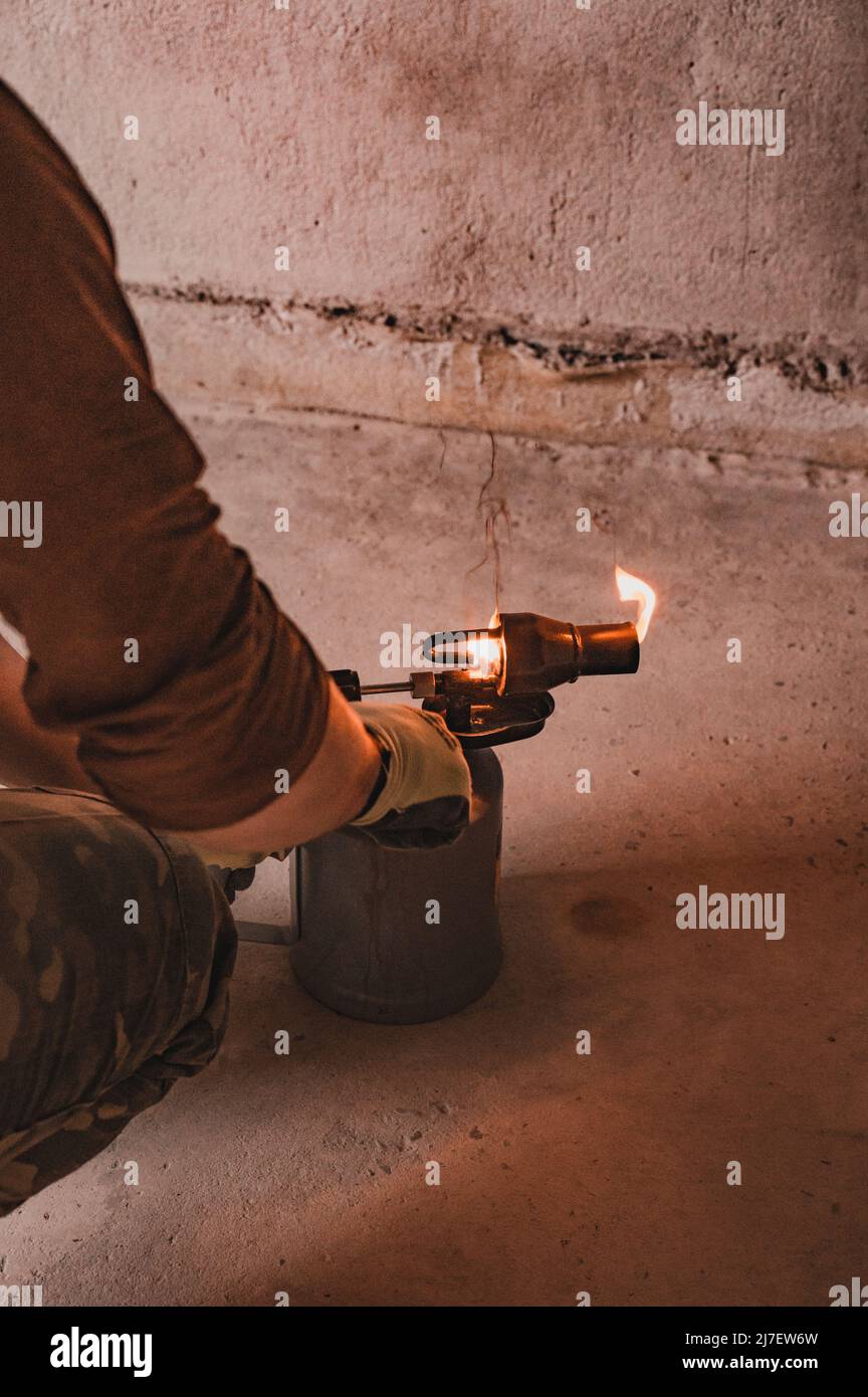 Gasoline blowtorch with a burning fire, the use of a blowtorch in ...