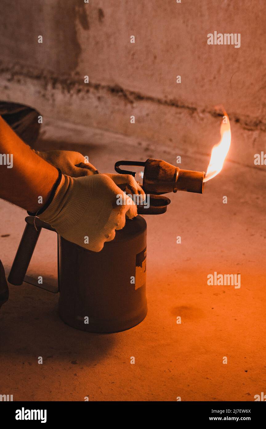 Gasoline blowtorch with a burning fire, the use of a blowtorch in ...