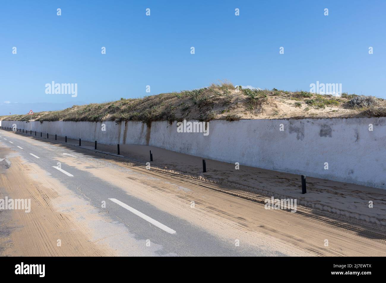 The street by the dunes in Praia de Faro in Faro Region, Algarve ...