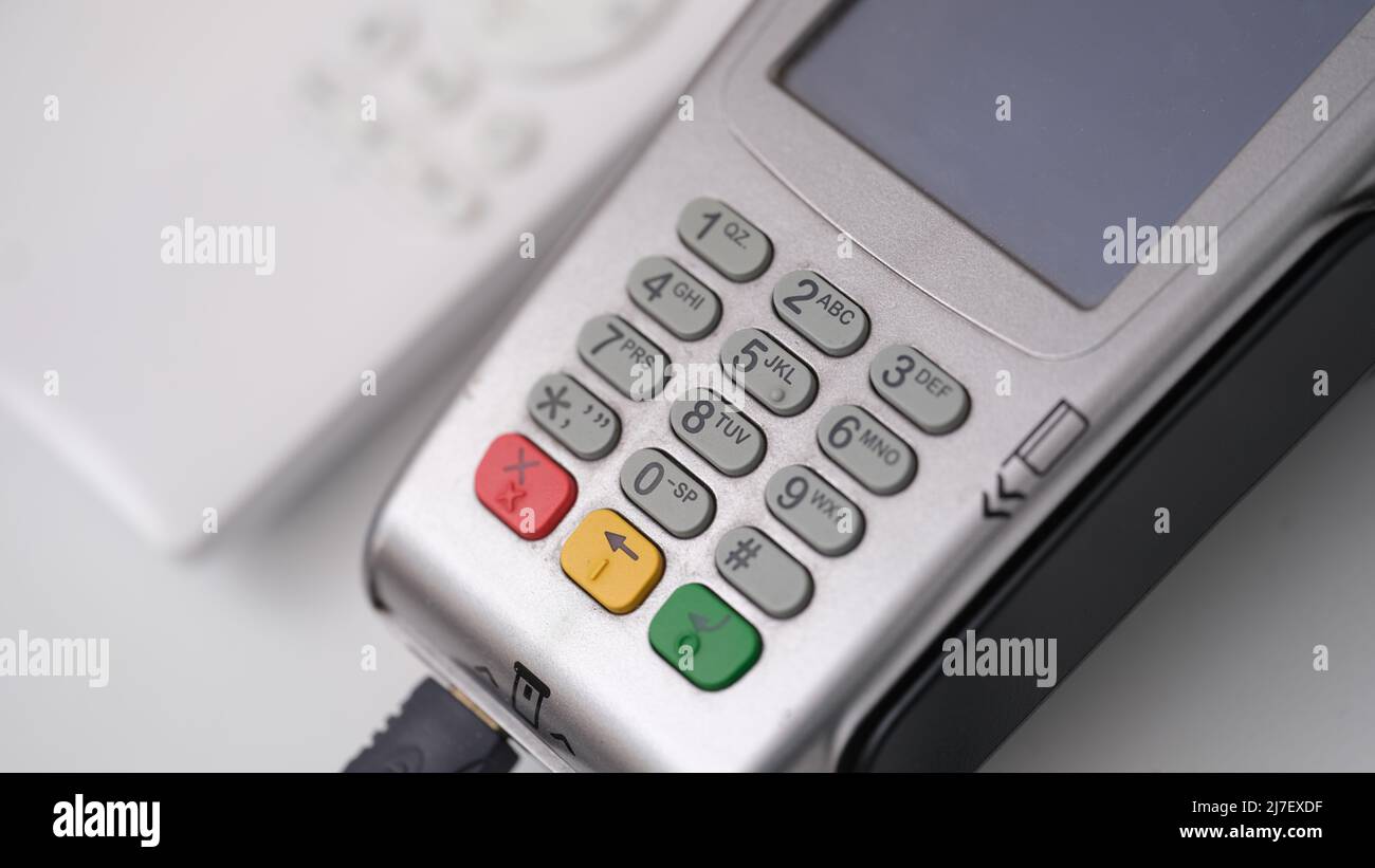 Terminal for non-cash payment by bank credit card Stock Photo - Alamy