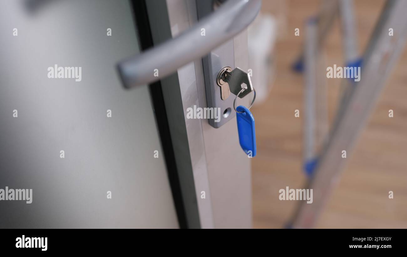 Gray door with steel lock and keys closeup Stock Photo - Alamy