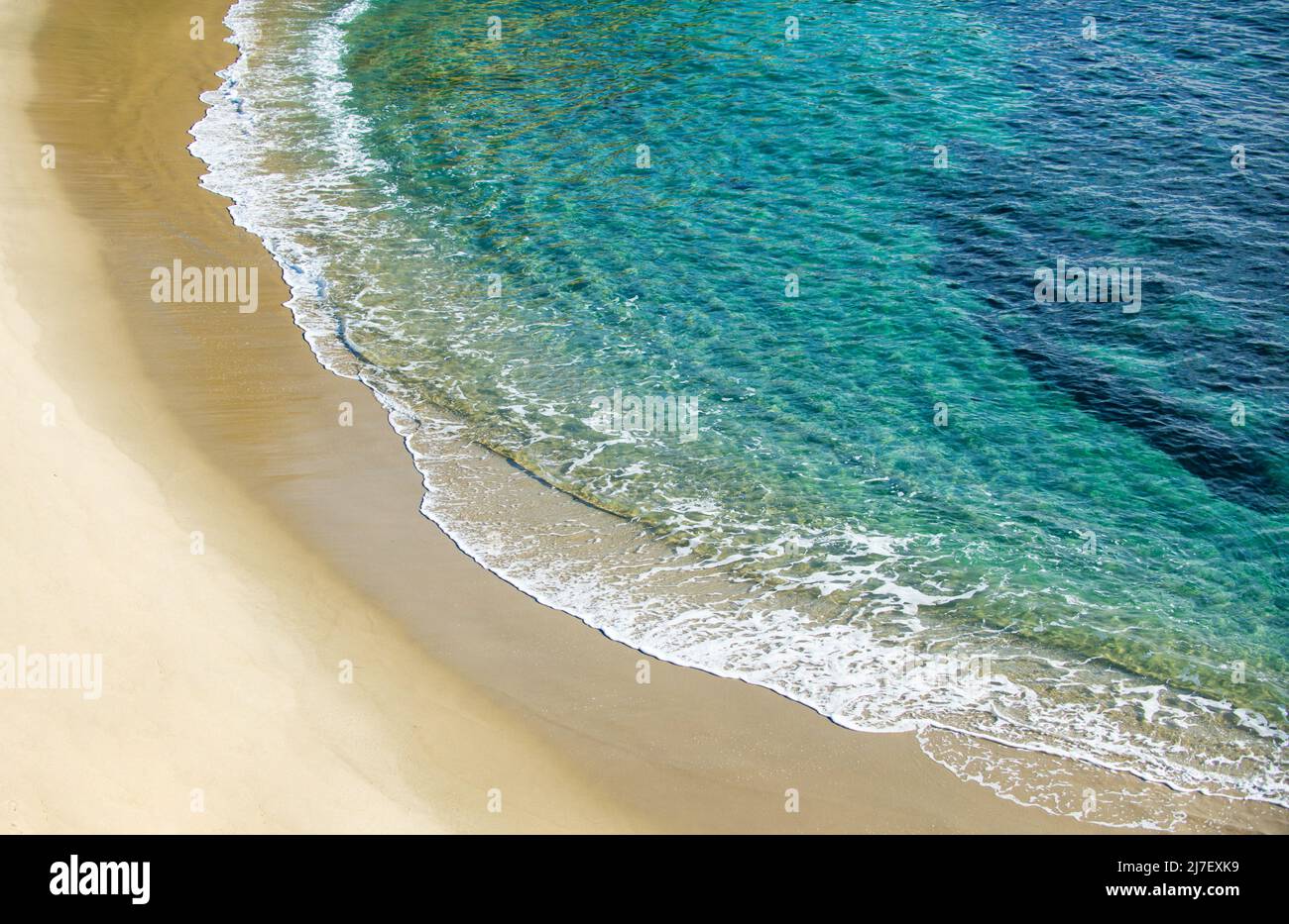 Summer beach, ocean waves on a tropical sea with deep blue wawes. Calm ...