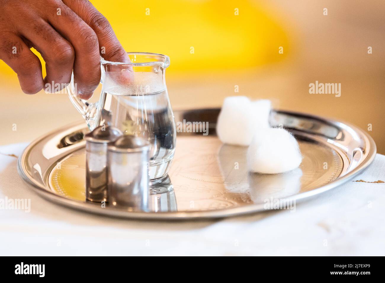 08 May 2022, Baden-Wuerttemberg, Rottweil: A carafe of baptismal water ...