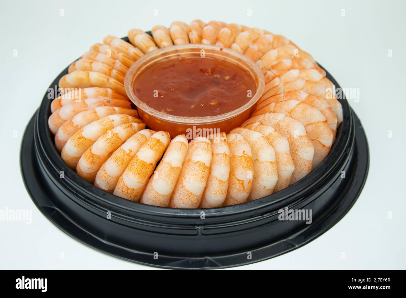 Seafood, boiled shrimp, beautifully decorated on a plate and the sauce ...