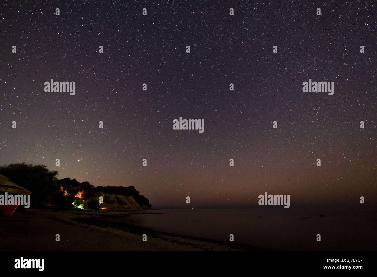 Starry sky over beach and sea Stock Photo - Alamy
