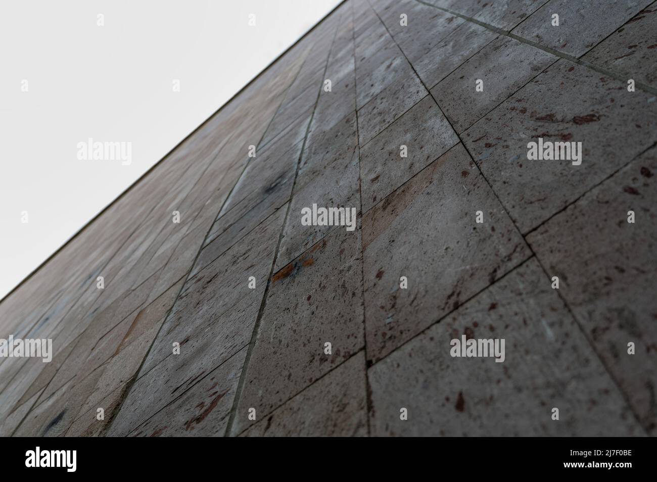 A view of the gray stone wall in the receding perspective. The outer ...