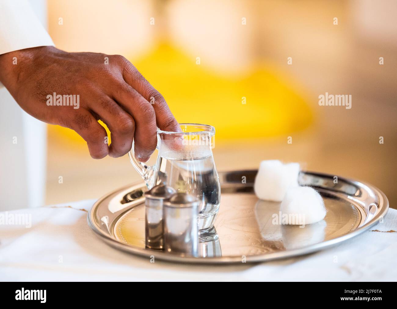08 May 2022, Baden-Wuerttemberg, Rottweil: A carafe of baptismal water ...